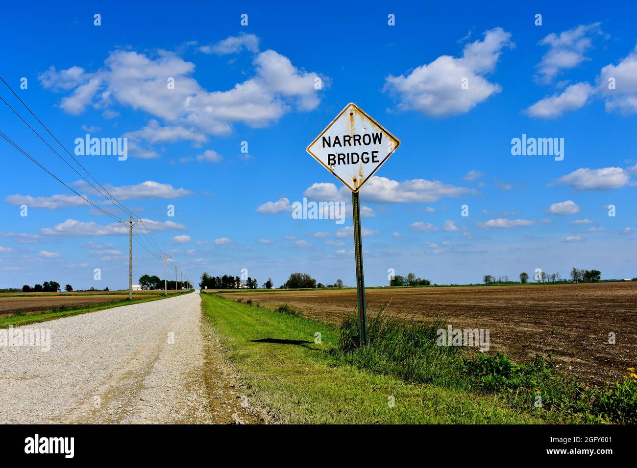 Faded road sign along an unpaved, country road in rural Indiana, United ...