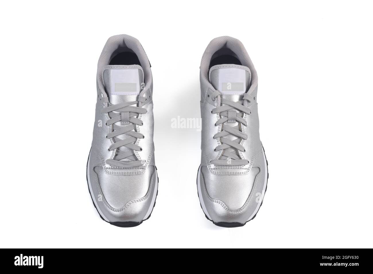 overhead view of some sports shoes on white background Stock Photo - Alamy