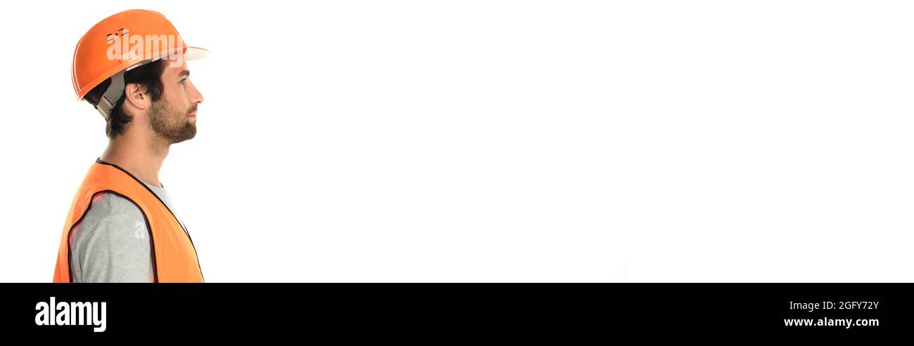 Side view of workman in helmet standing isolated on white, banner Stock ...