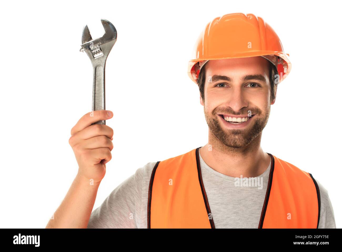 Positive builder in hard hat holding wrench isolated on white Stock ...