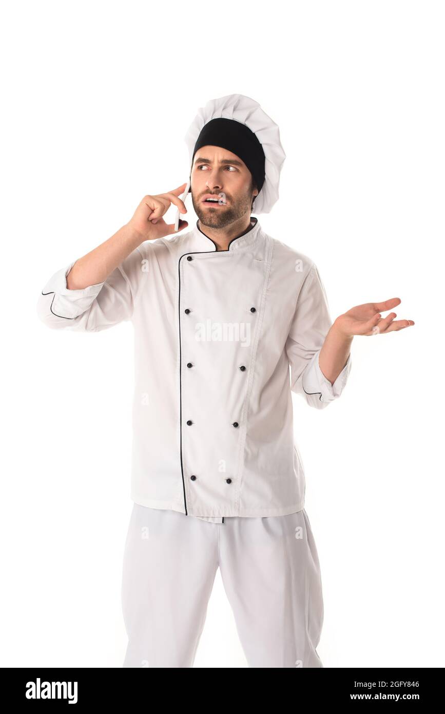 Confused chef talking on smartphone isolated on white Stock Photo - Alamy