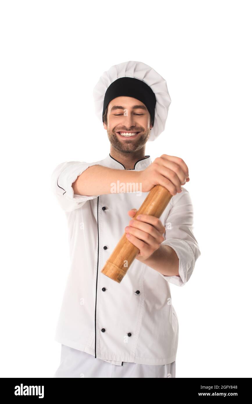 Smiling chef holding pepper mill isolated on white Stock Photo - Alamy