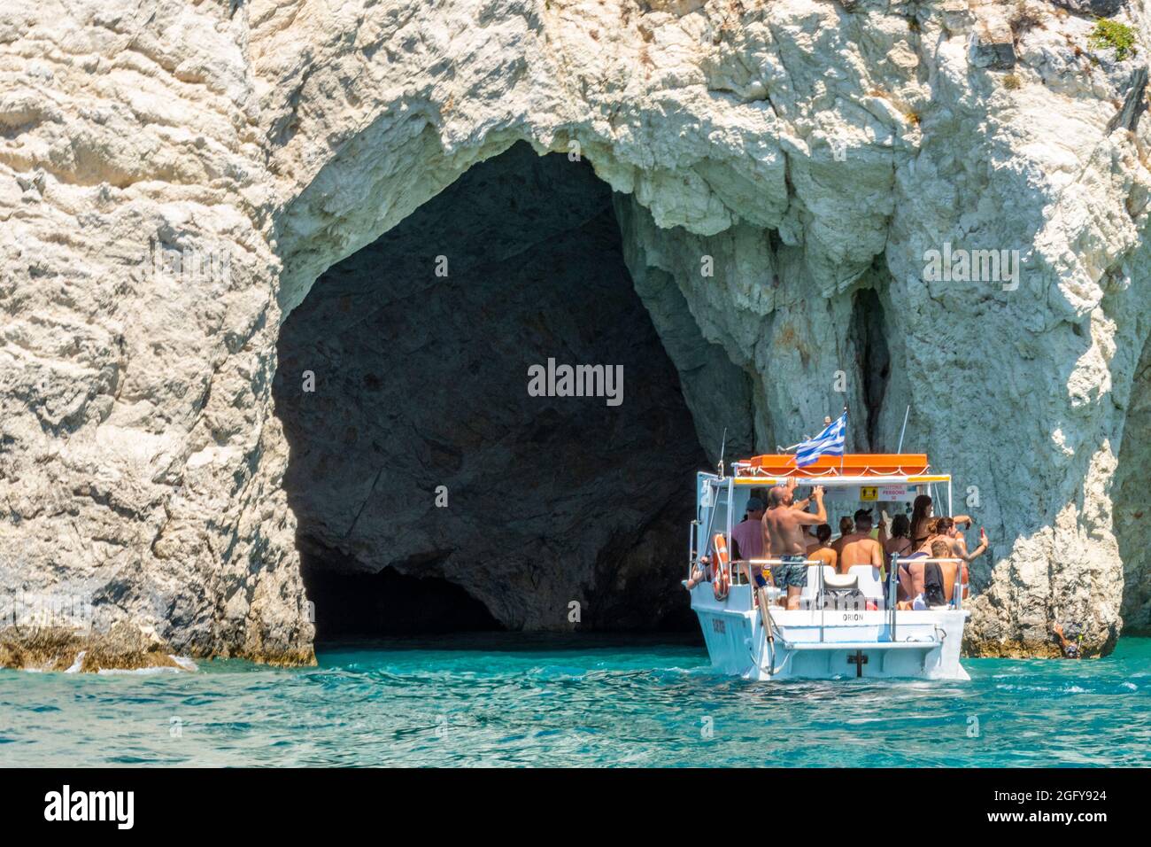 zakynthos caves, zante caves, tourists on boat at zakynthos caves, keri ...