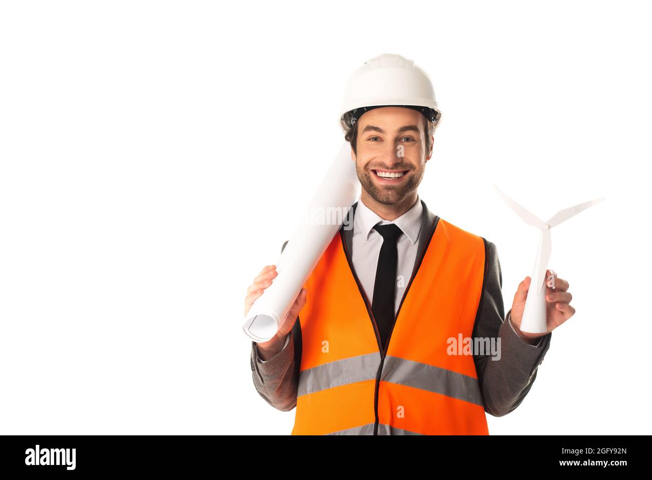Smiling engineer with blueprint and model of wind turbine isolated on ...