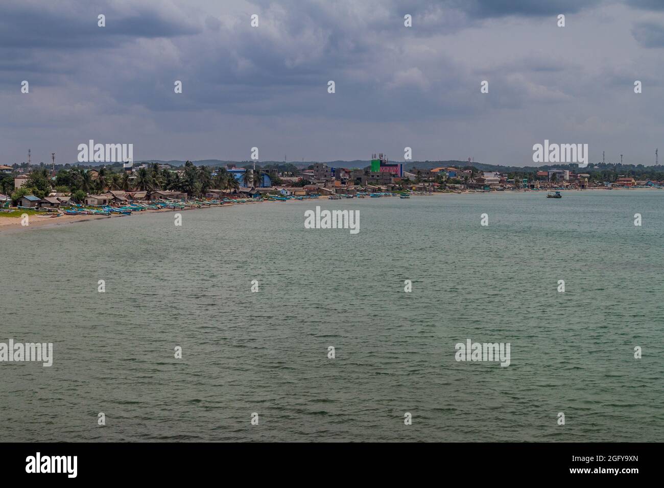 Boats on a sea coast in Trincomalee, Sri Lanka Stock Photo - Alamy
