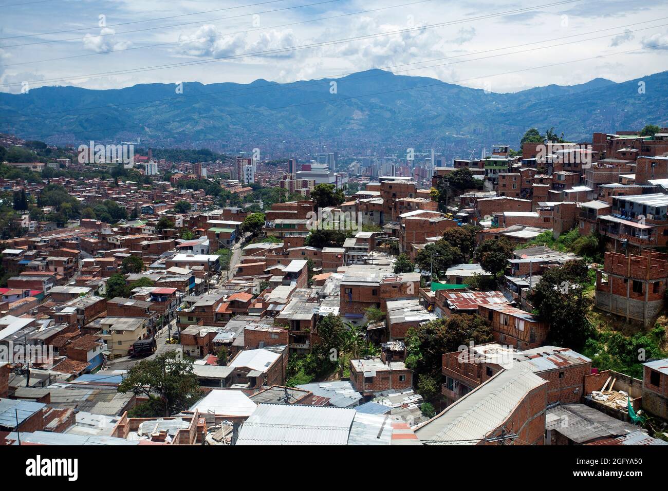Poor neighborhoods on the slopes of the city of Medellin, Colombia ...