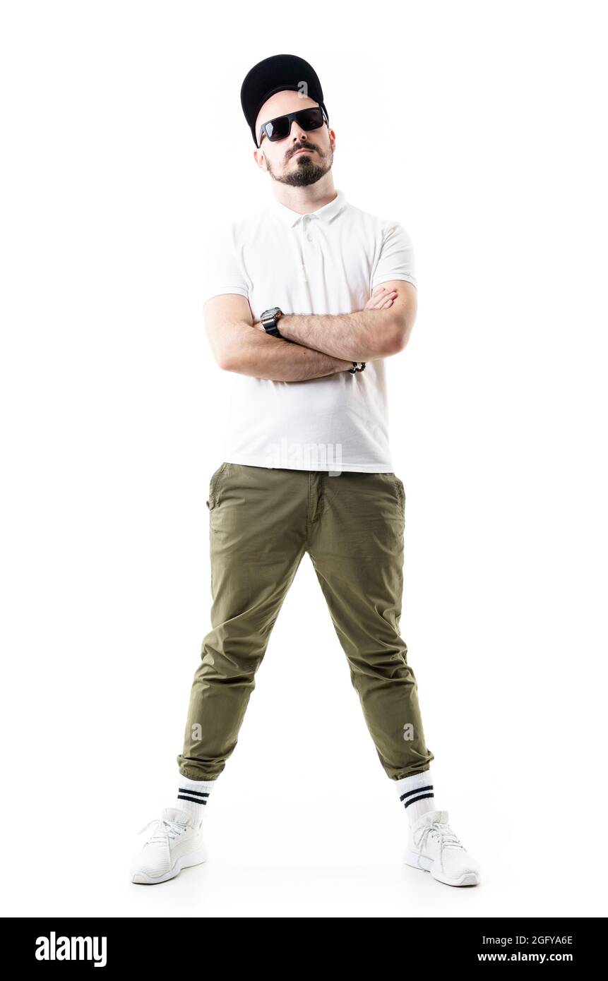 Cocky confident attitude stylish young man posing with crossed arms ...