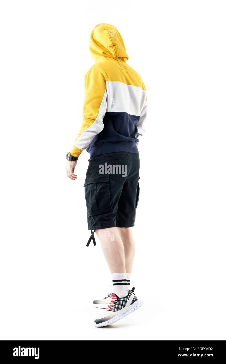 Back view of young handsome stylish man in urban hip hop style fashion ...