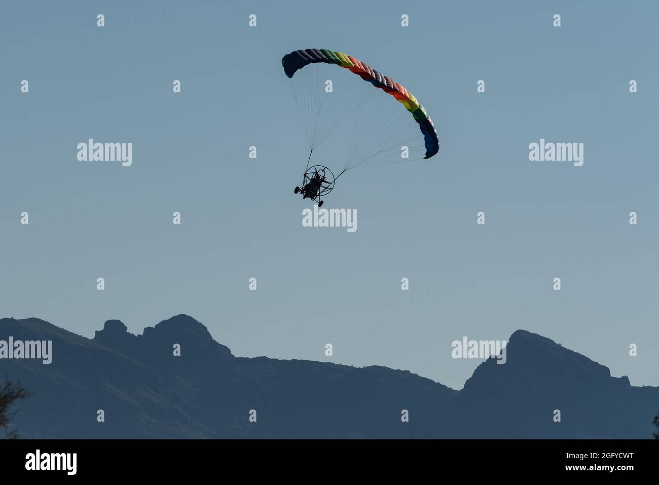 A powered parachute or PPC flies near Quartzsite, Arizona with the ...