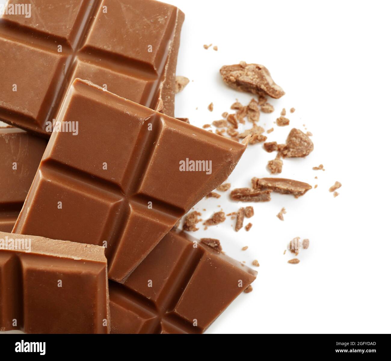 Broken chocolate bar on white background Stock Photo - Alamy