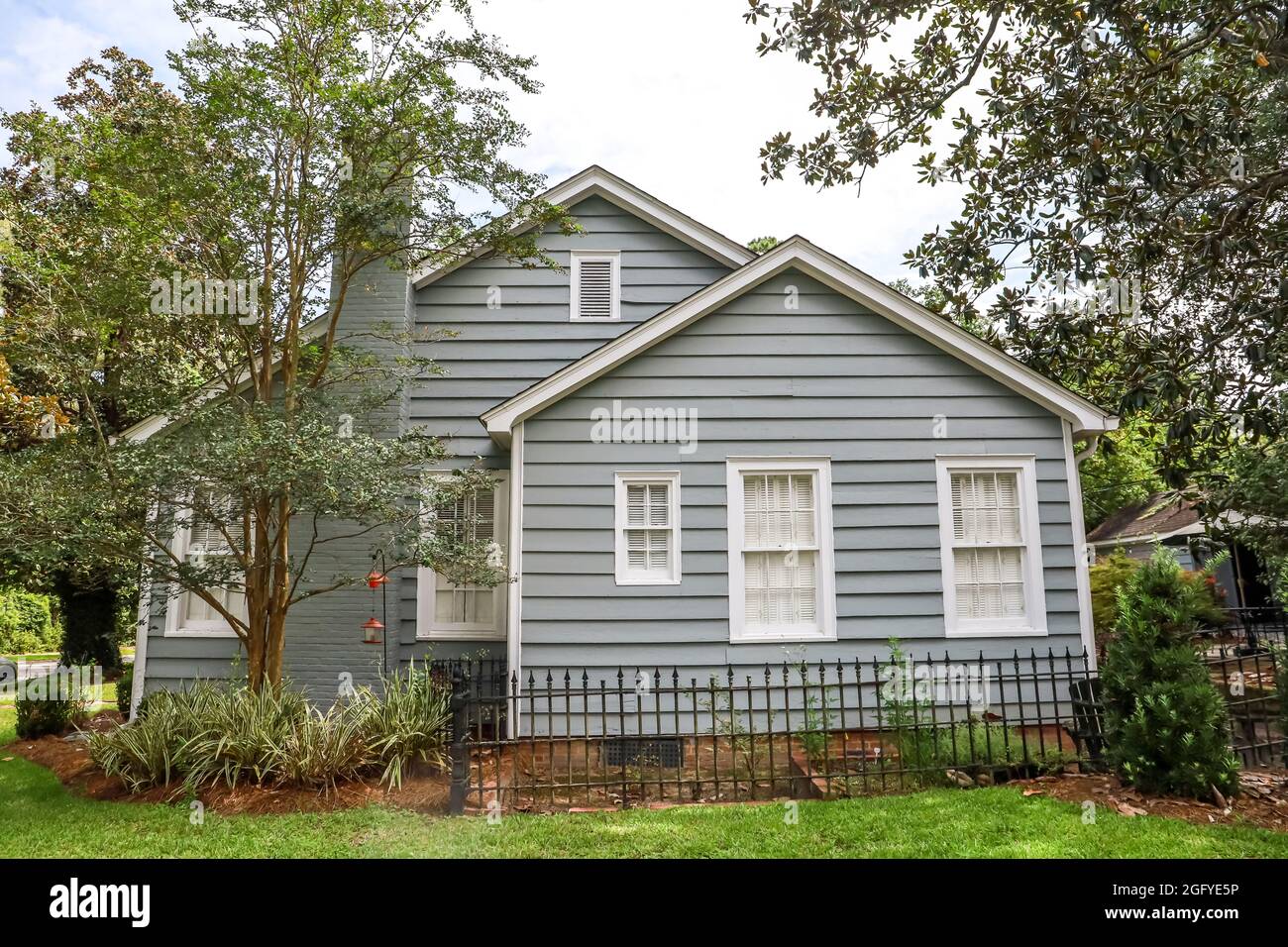 A revently renovated blue small cottage style house Stock Photo - Alamy