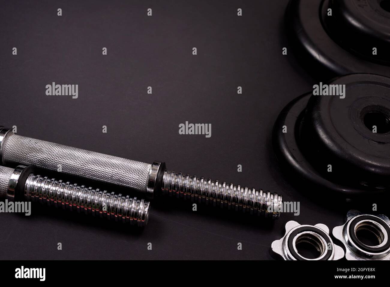 Fitness or bodybuilding. Sports equipment on a black background ...