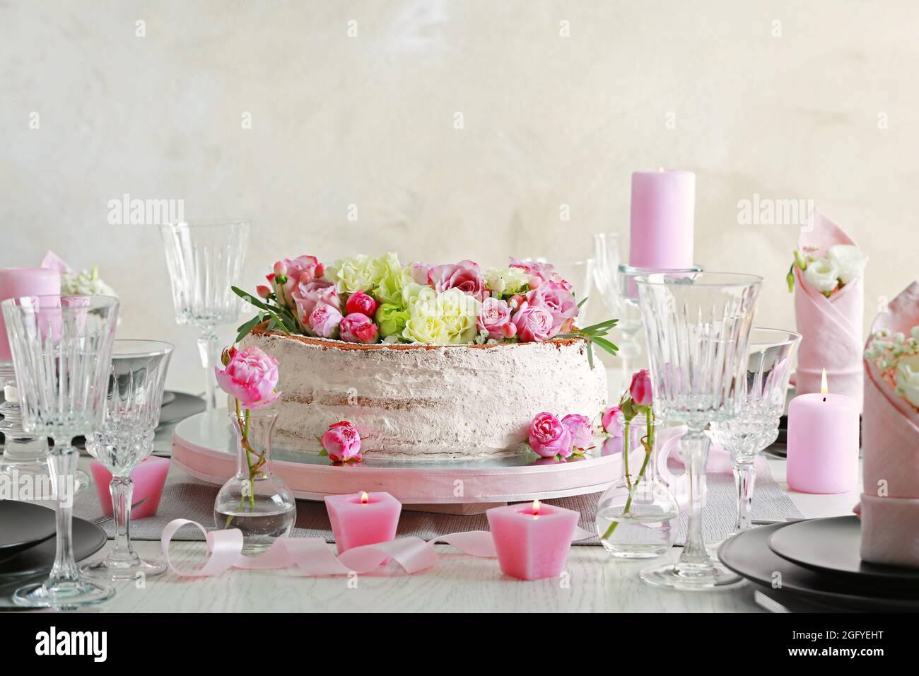 Delicious cake decorated with flowers on blurred background Stock Photo ...