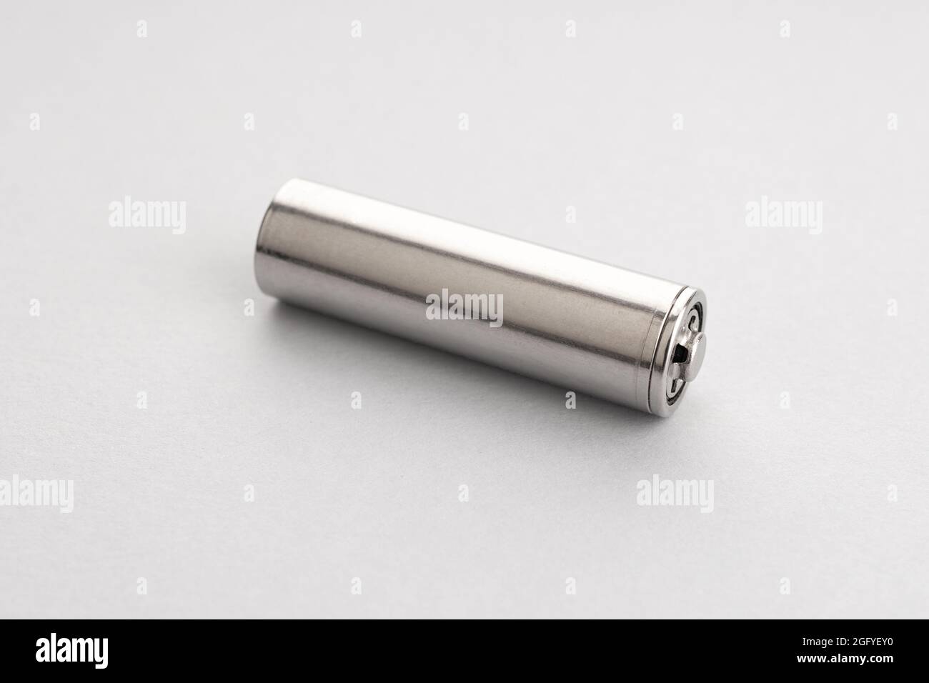 Blank metallic battery isolated on gray background Stock Photo - Alamy
