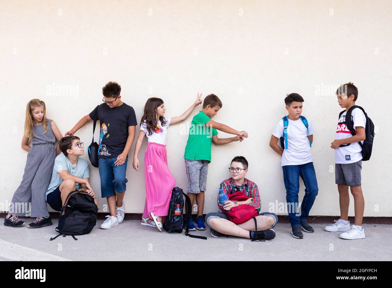 Group of elementary school kids having fun before classes. Back to ...
