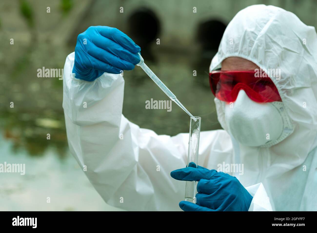 Sampling from open water. A scientist or biologist takes a water sample ...