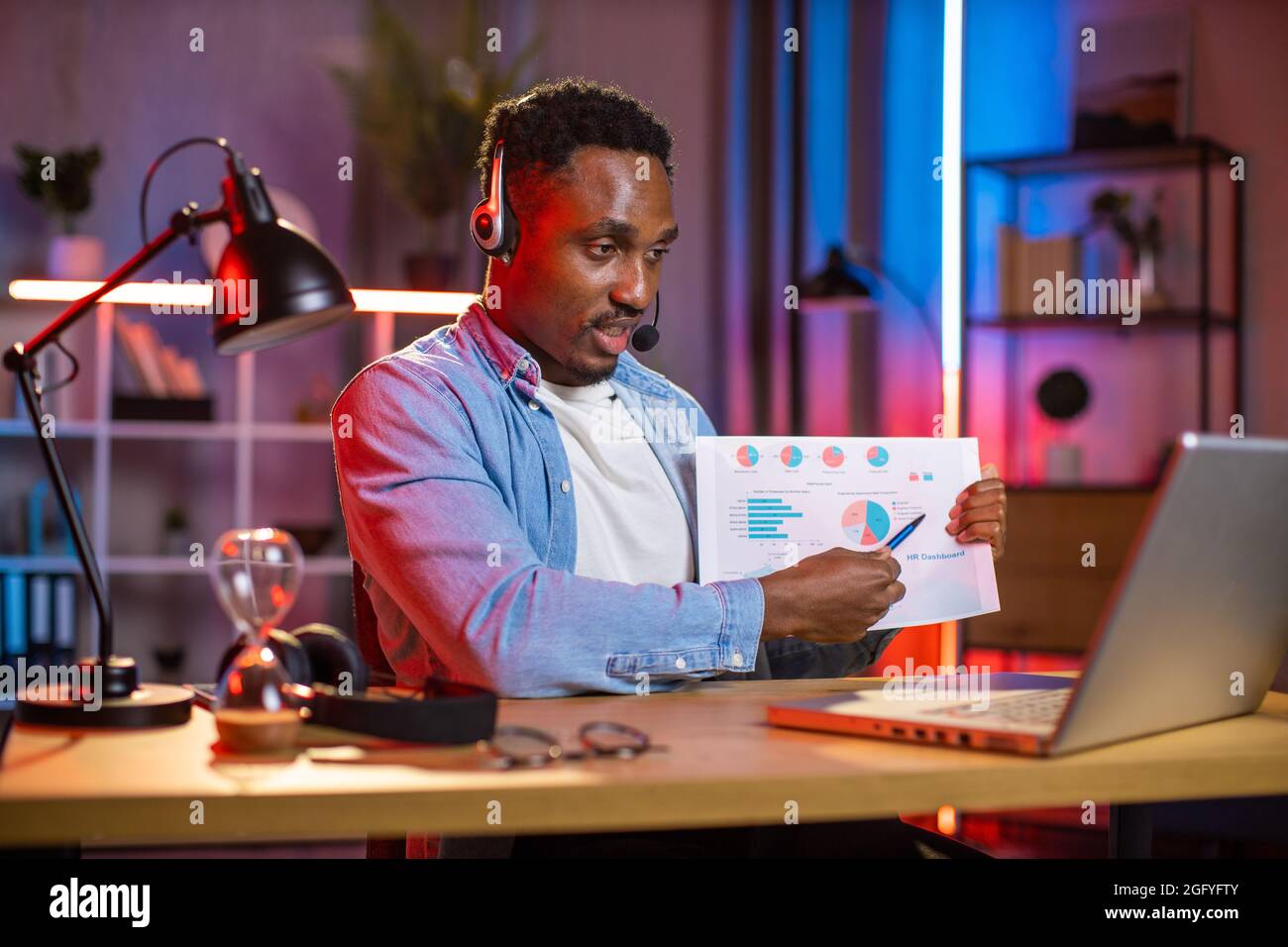 African american man in headset having video conference on modern ...