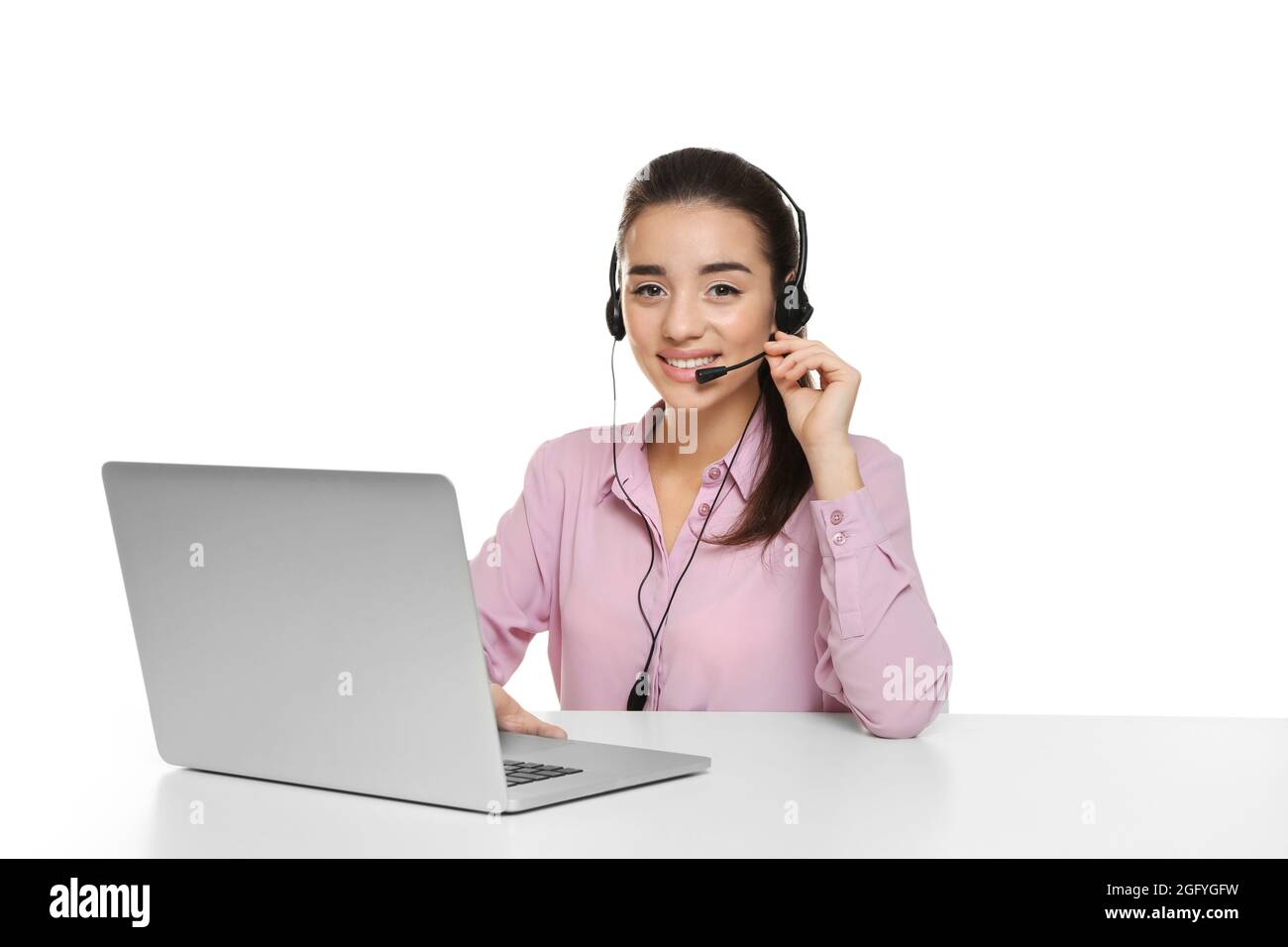 Pretty technical support dispatcher working with laptop, on white ...