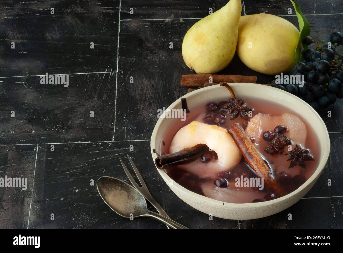 Pear punch with spices Stock Photo - Alamy