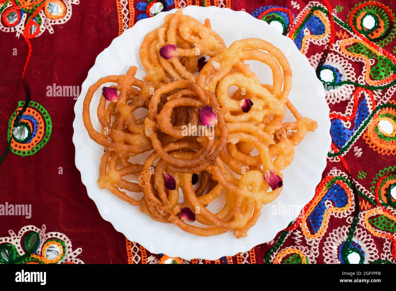 Popular and traditional Sweet dish Jalebi or Zulbia deep fried in ghee ...