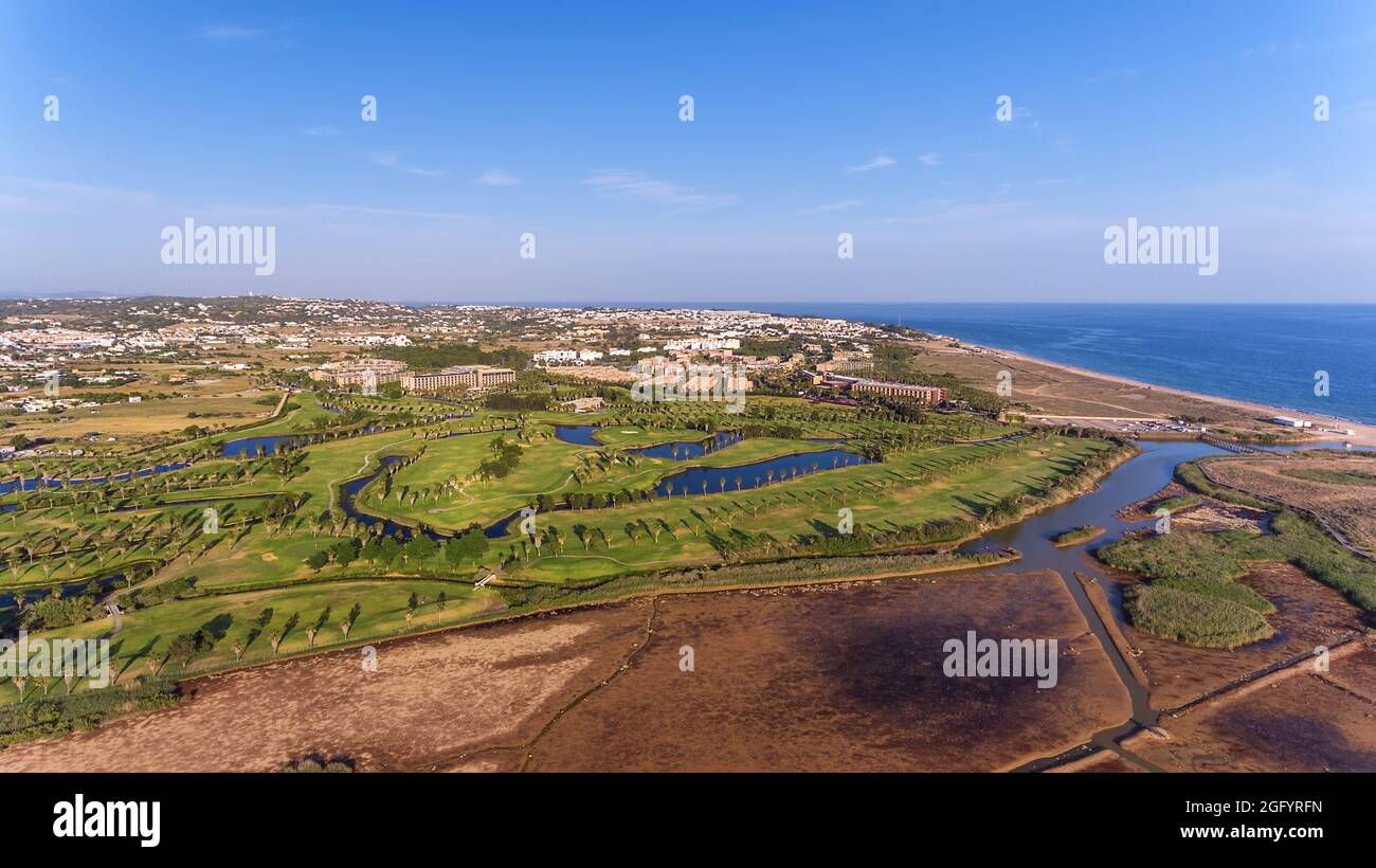 Green golf courses by the sea. Salgados beach. Portugal, Albufeira ...