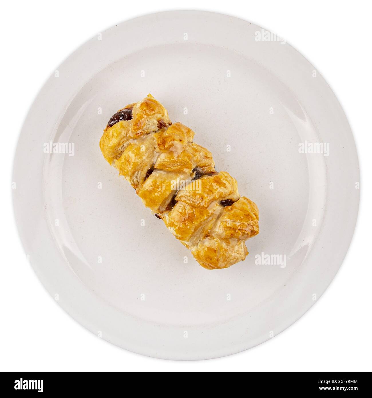 Overhead shot of a stuffed braid bread on a plate isolated on white ...