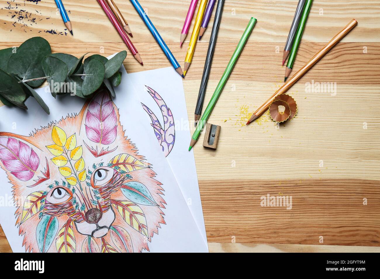 Composition of coloring and pencils on wooden table Stock Photo - Alamy