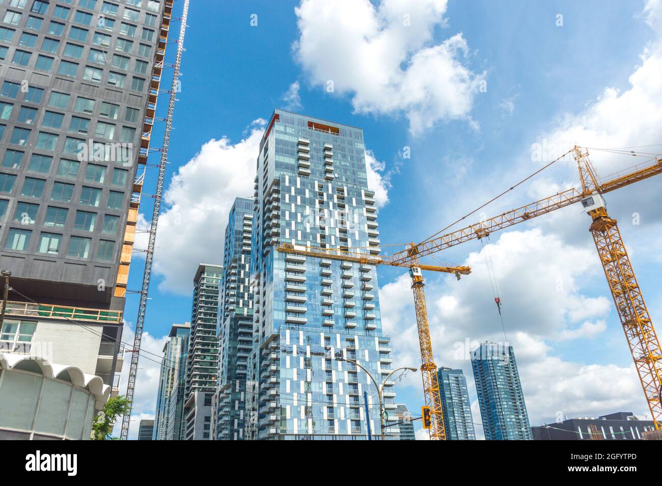Construction of the modern condo buildings with huge windows and ...