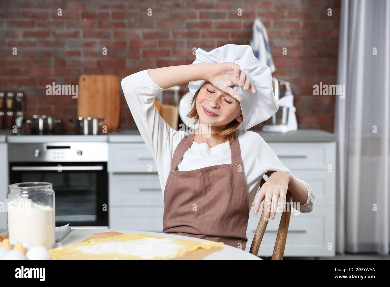 Cute girl cooking in kitchen at home Stock Photo - Alamy