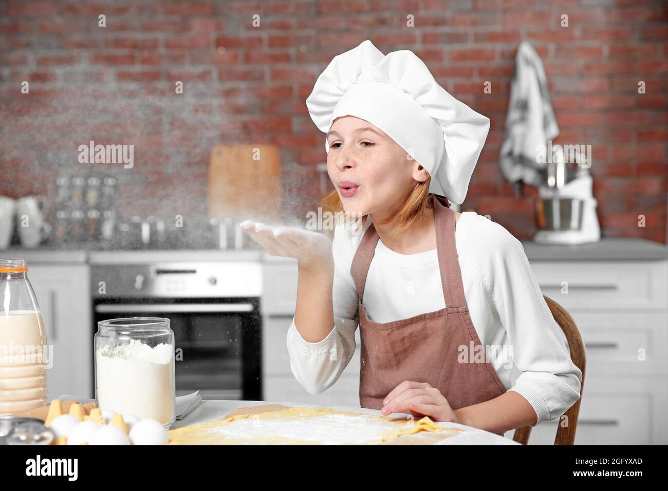 Cute girl cooking in kitchen at home Stock Photo - Alamy