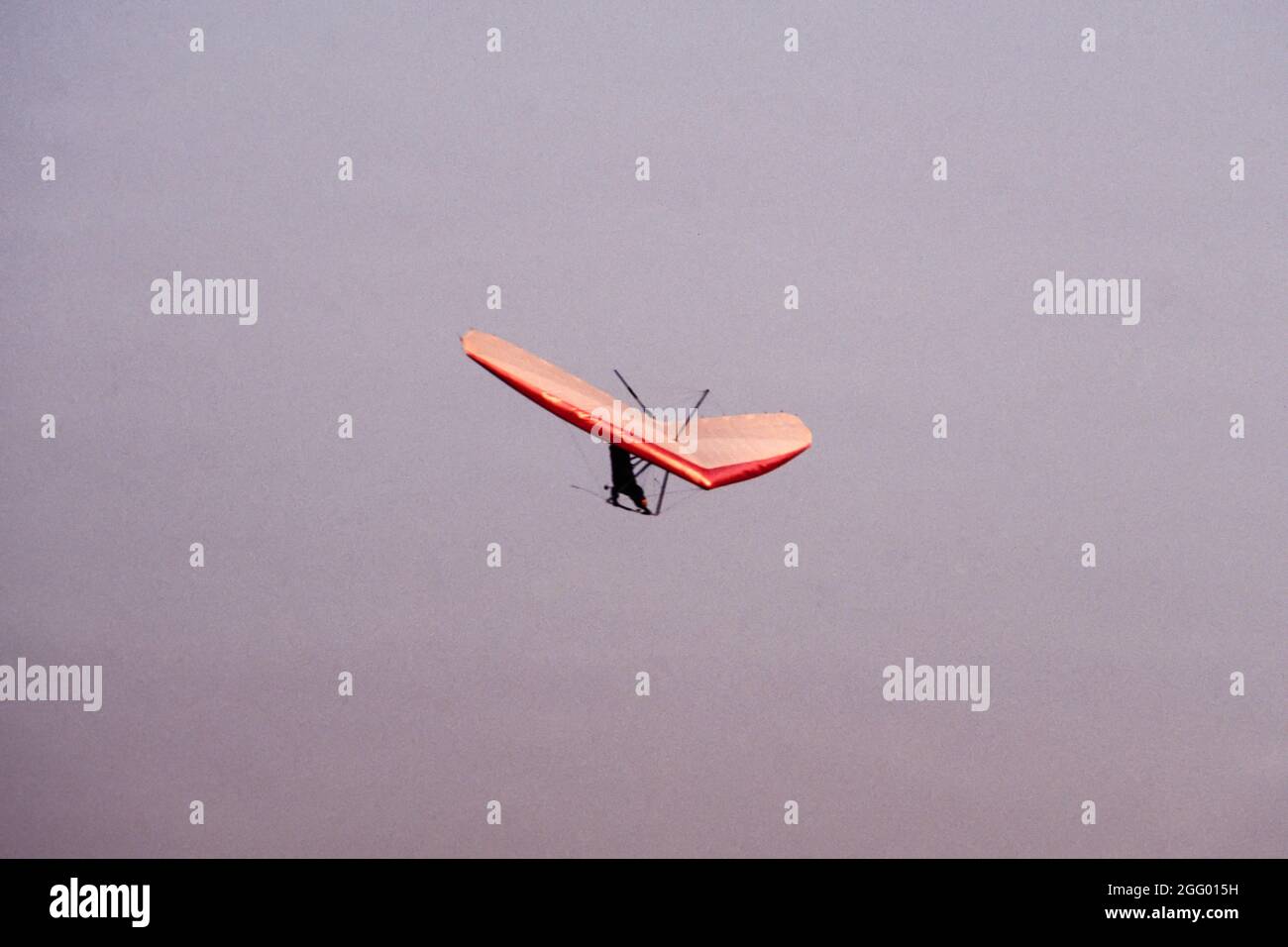 A hang glider pilot completes a loop while fying aerobatics near ...