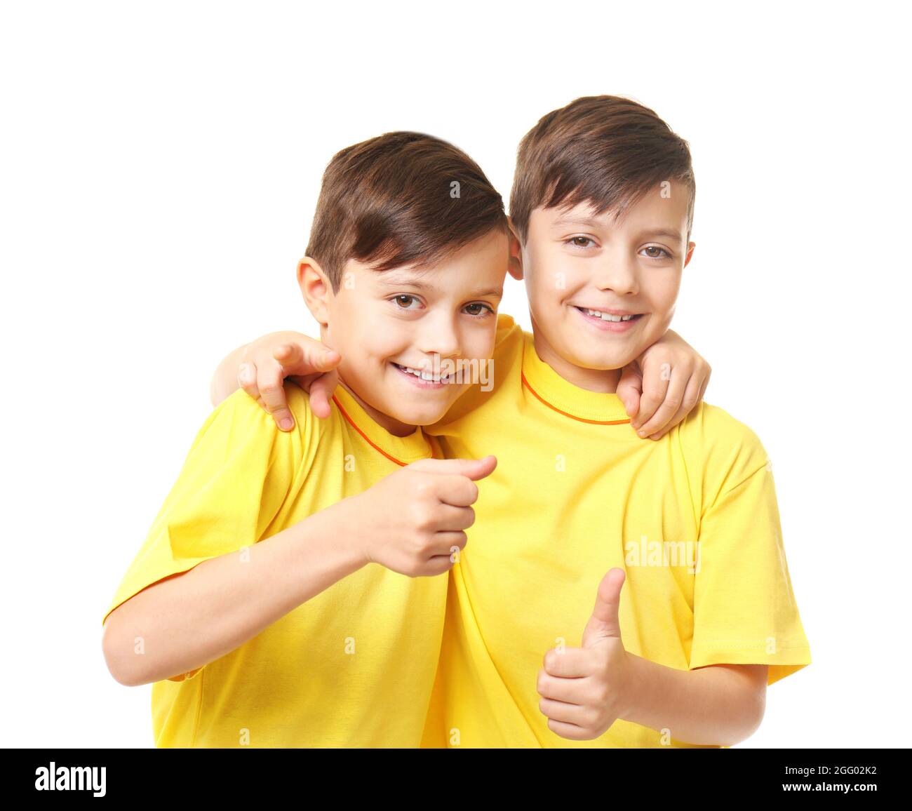 Twin brothers on white background Stock Photo - Alamy