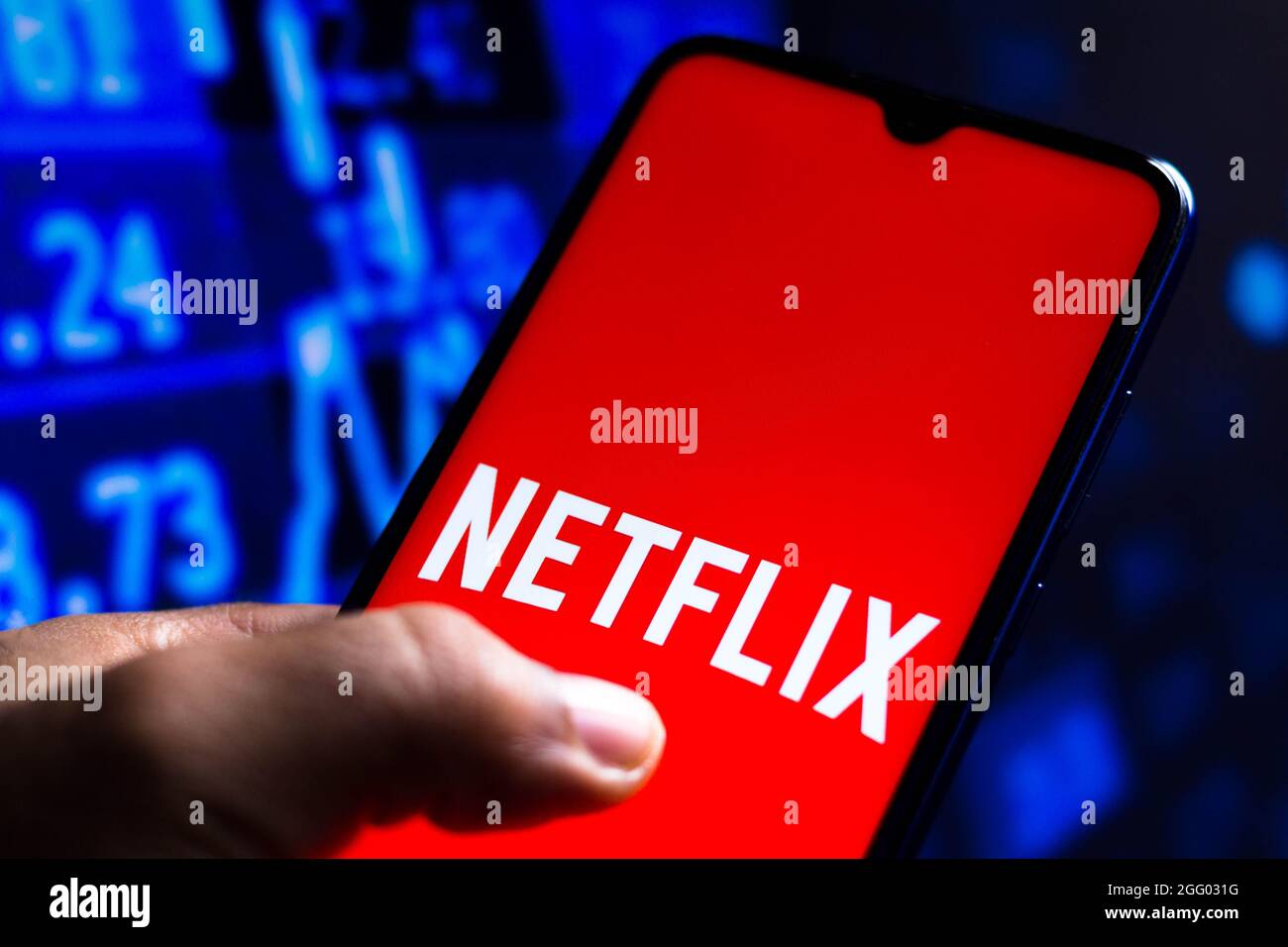 In this photo illustration the Netflix logo seen displayed on a ...