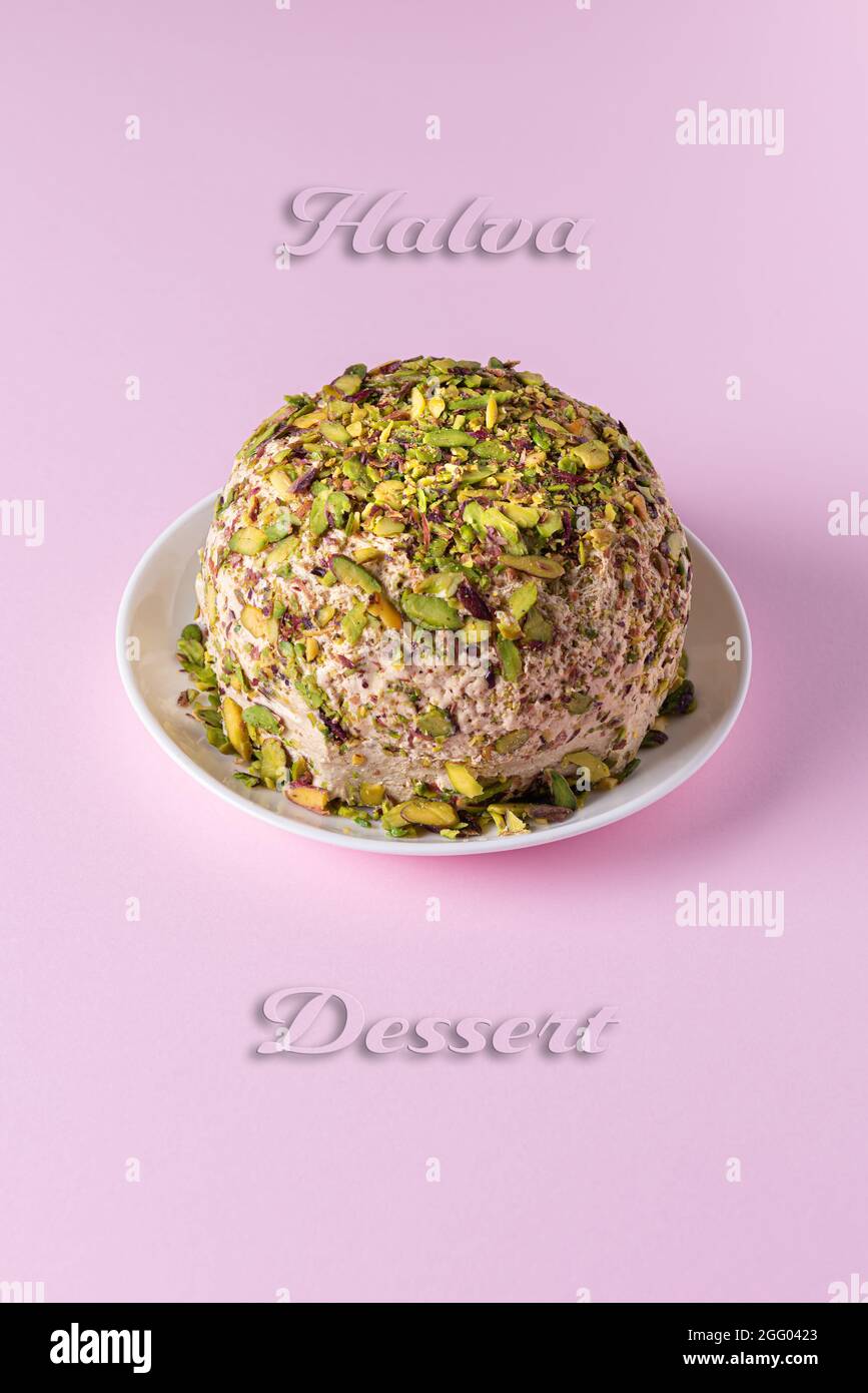 Sesame halva with pistachios nuts on pink paper background with Halva ...