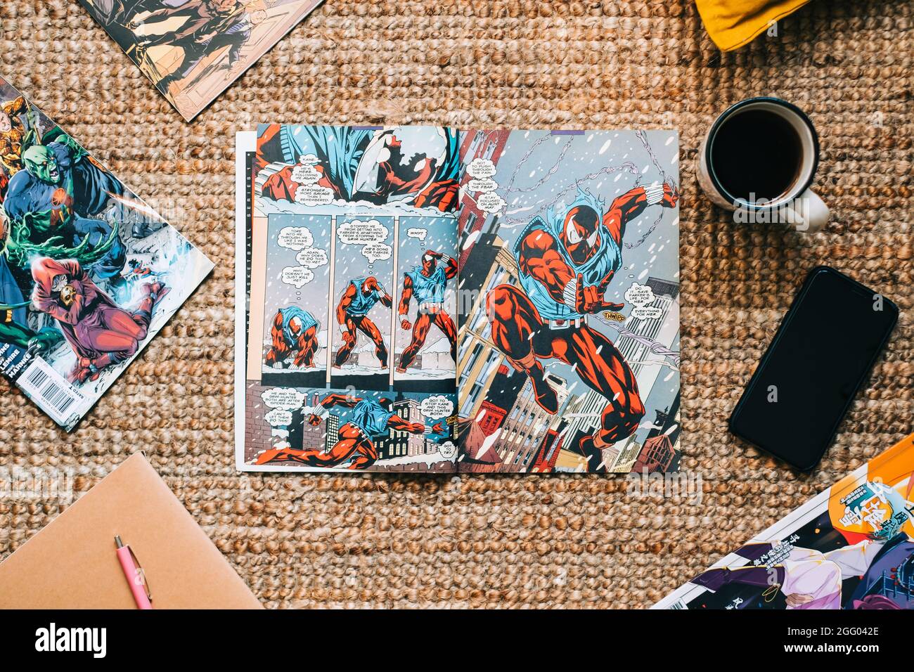 Reading comic books and manga on the carpet at cozy home Stock Photo ...