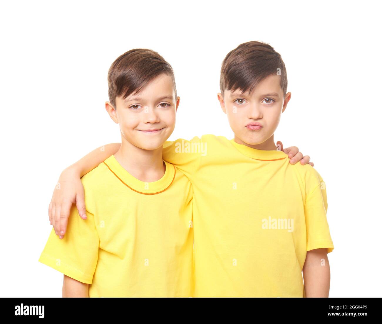 Twin brothers on white background Stock Photo - Alamy