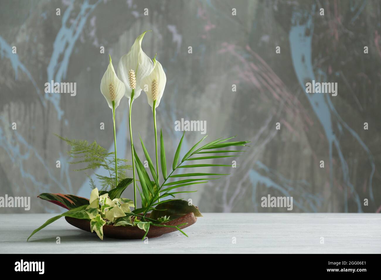 Flower arrangement on a color background Stock Photo - Alamy