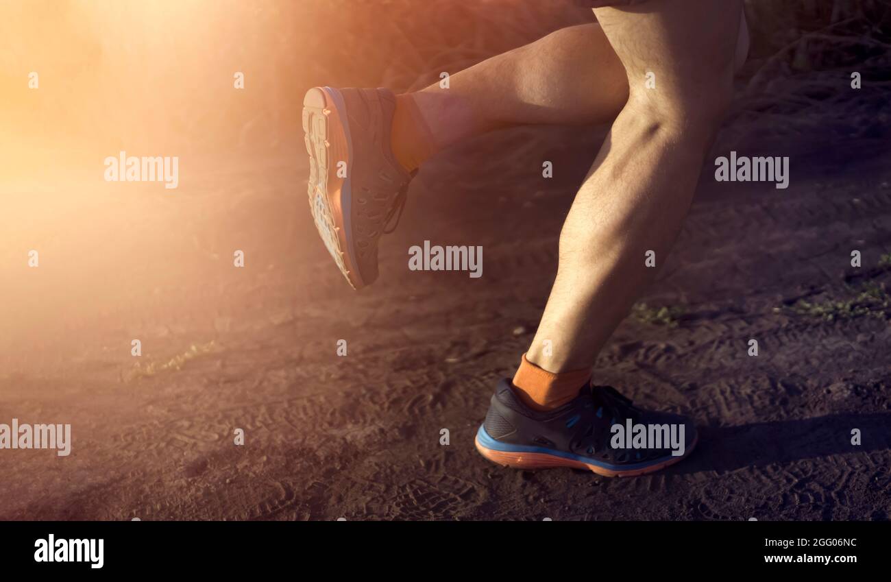 Athlete runner legs jogging close-up Stock Photo - Alamy