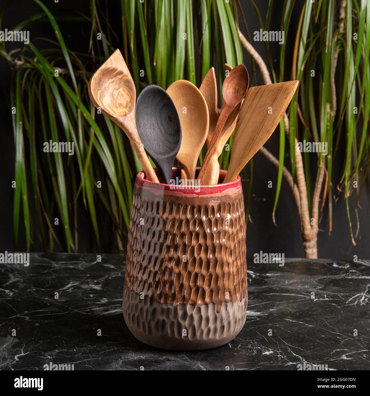 handmade wooden spoons in a ceramic vase Stock Photo - Alamy