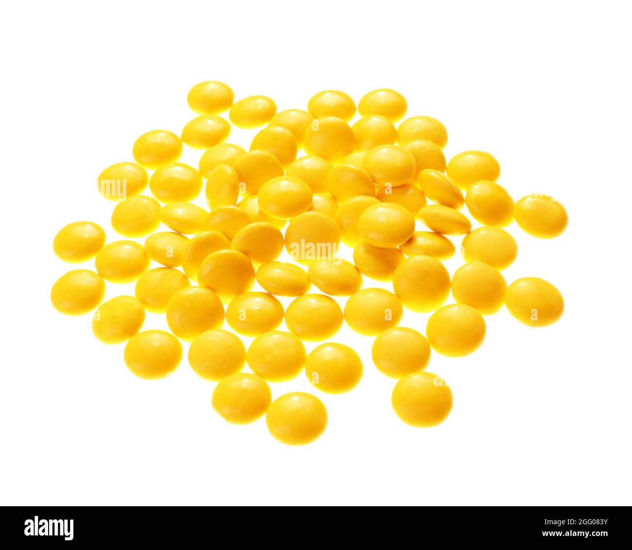 Yellow candies on white background Stock Photo - Alamy