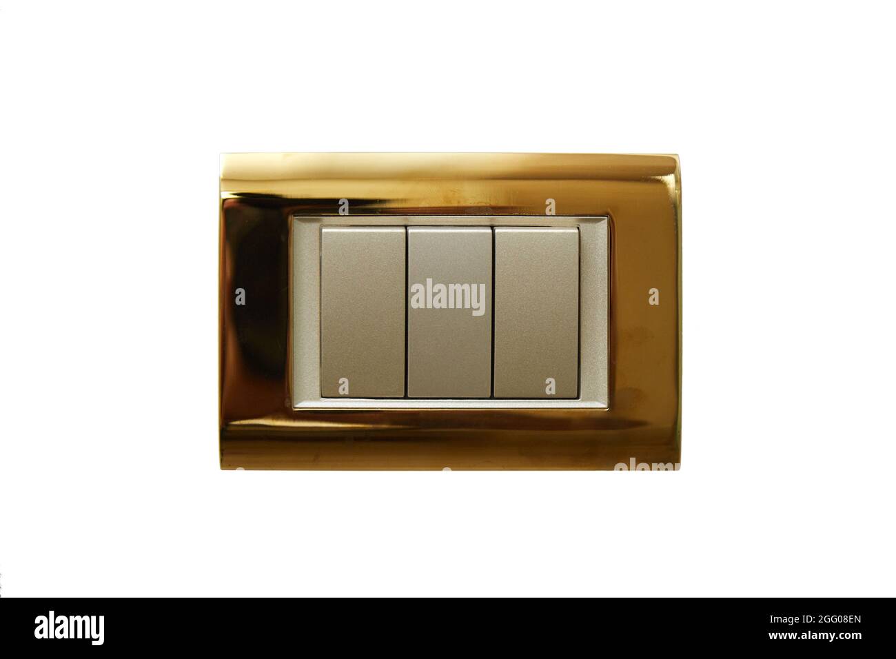 wall-mounted electric switch or socket in a gold-plated frame on a ...