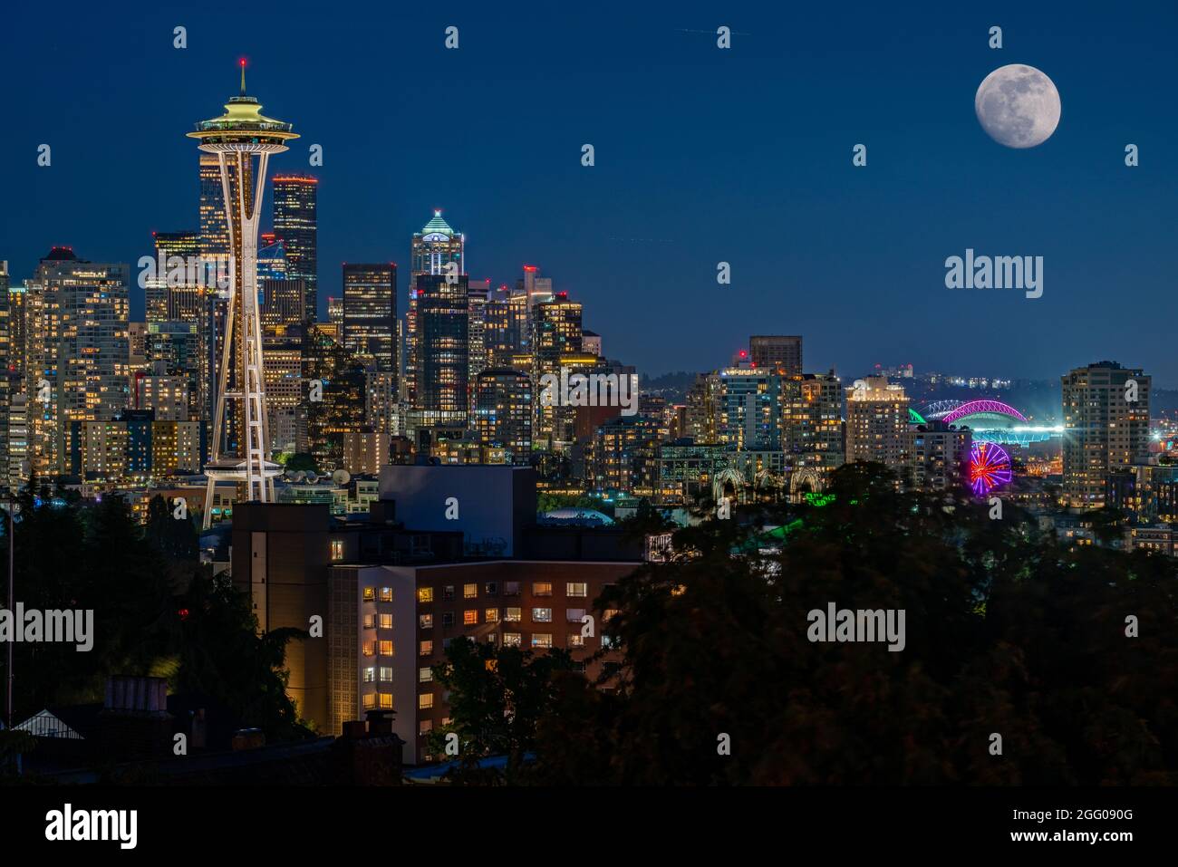 view of Downtown Seattle Space Needle at Night with Full Moon in the ...