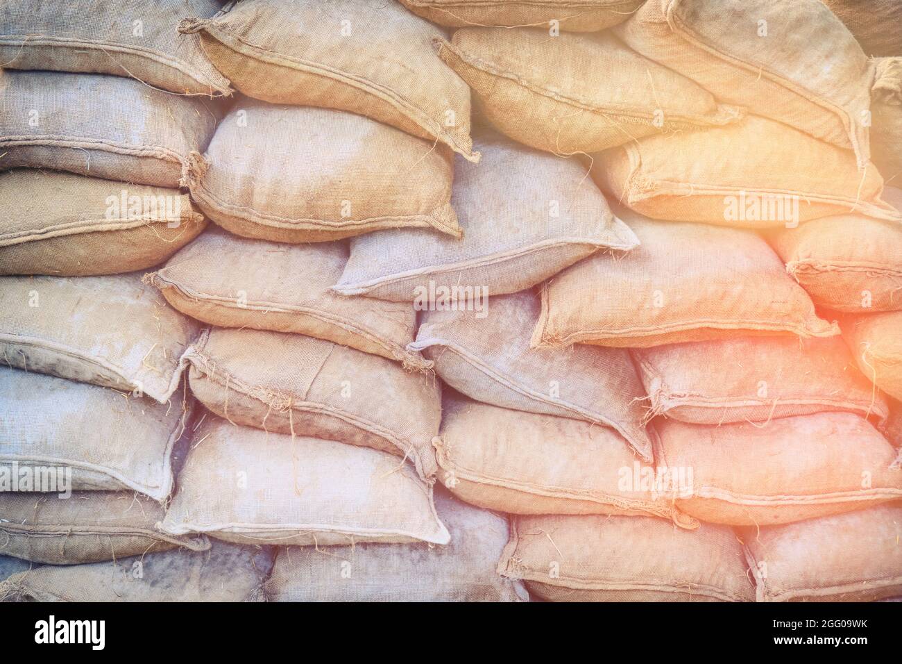 Background of lying grey sandbags. Sandbag flood protection wall ...
