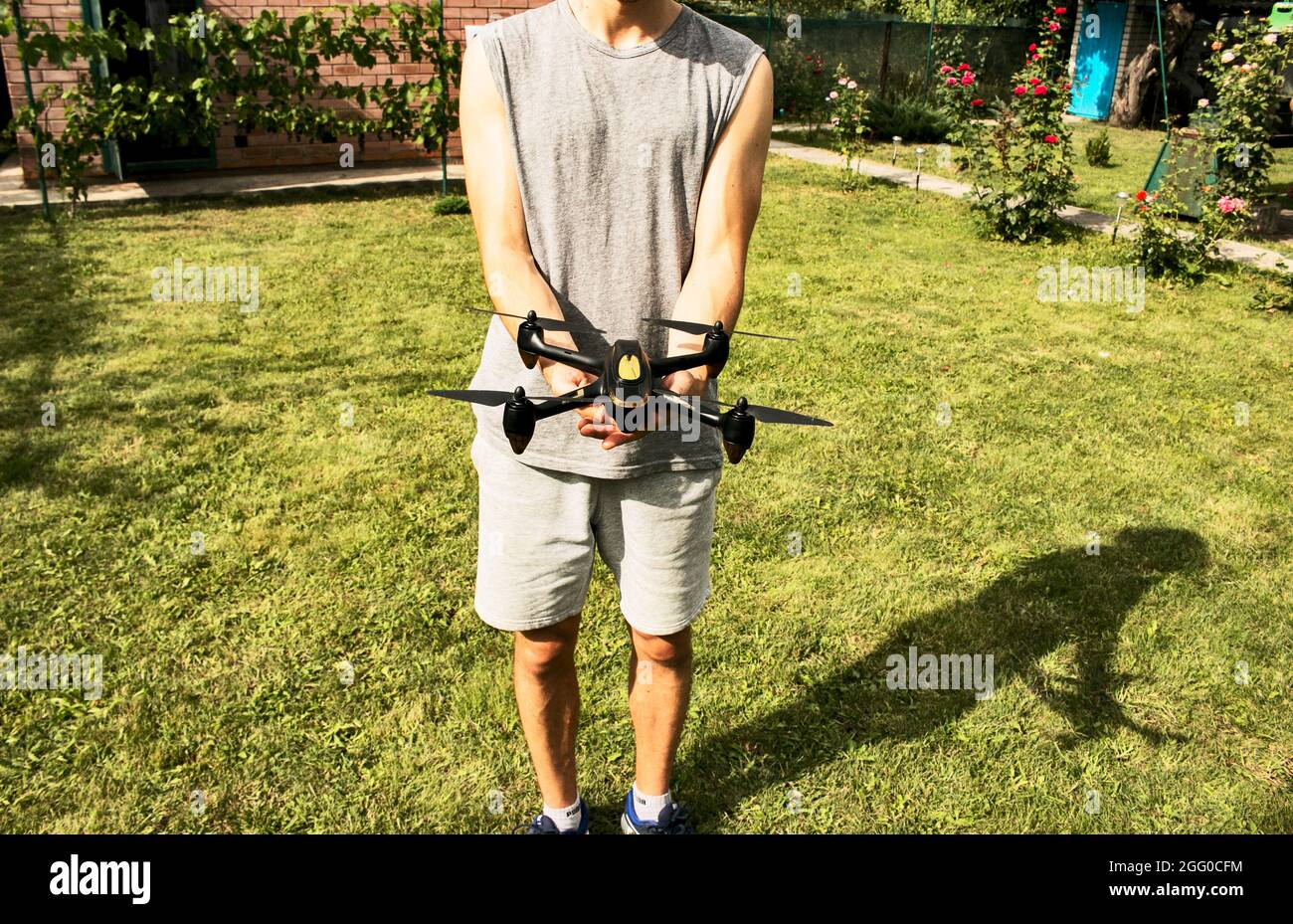 Modern small compact quadcopter in a man's hand. Launching a drone from ...