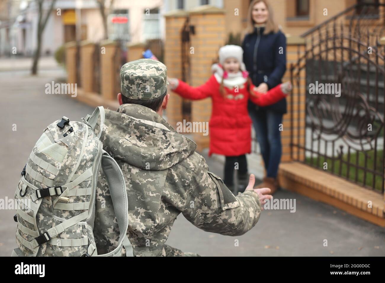 Happy reunion of soldier with family outdoors Stock Photo - Alamy