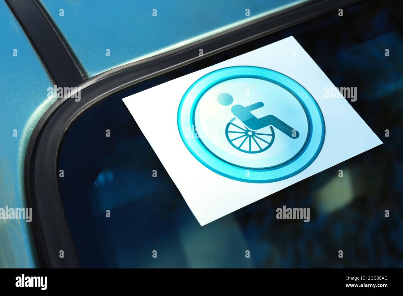 Symbol of handicapped on car windshield, closeup Stock Photo - Alamy