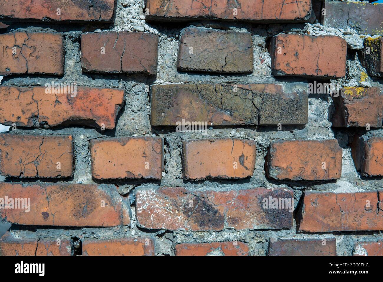 Close up old weathered orange brick wall fragment Stock Photo - Alamy