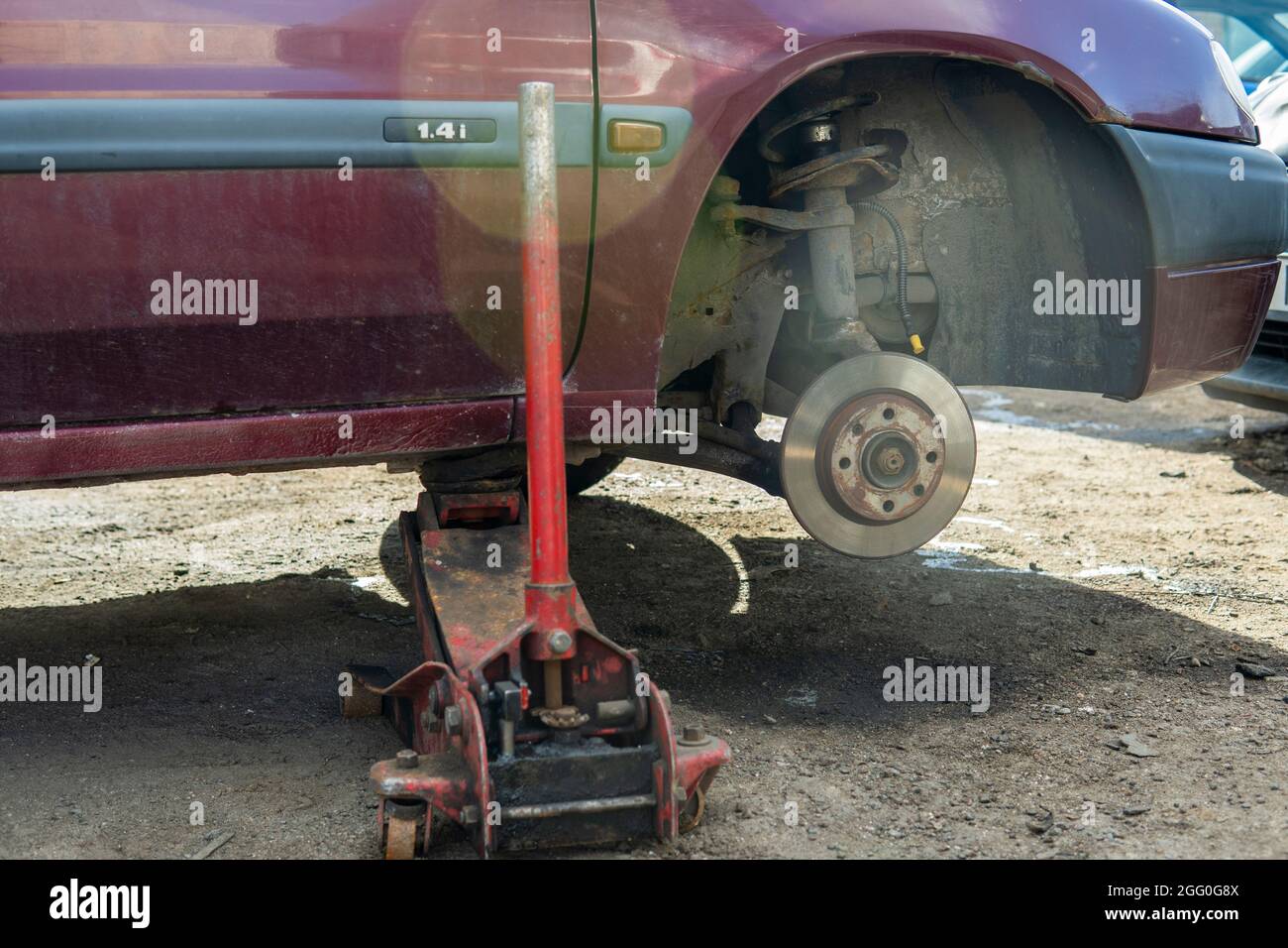 old jack lift the car to remove the wheel Stock Photo - Alamy