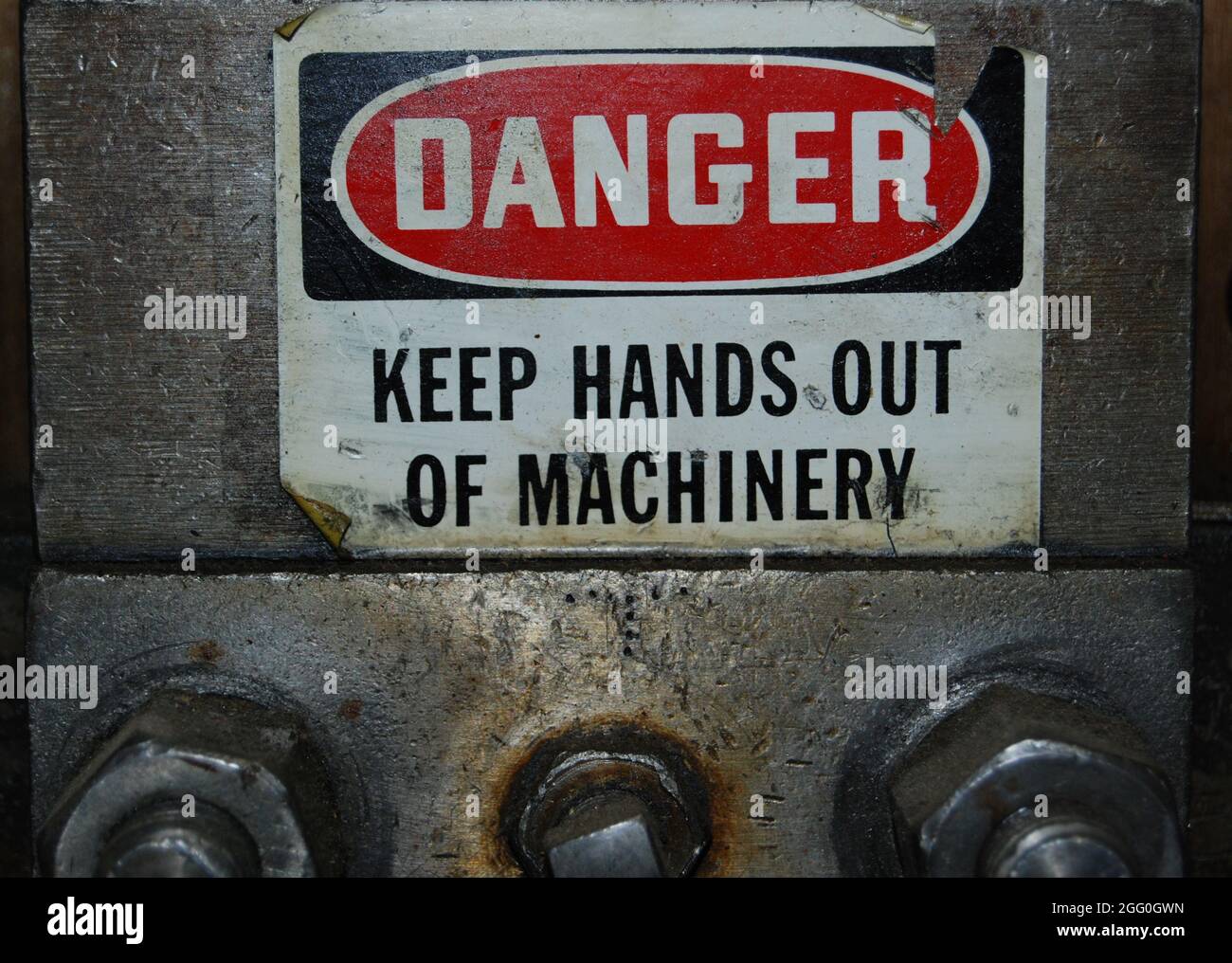 Danger sign on an old machine Stock Photo - Alamy