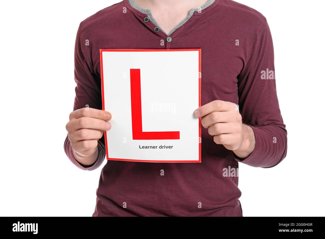 Young man with learner driver sign on white background, closeup Stock ...